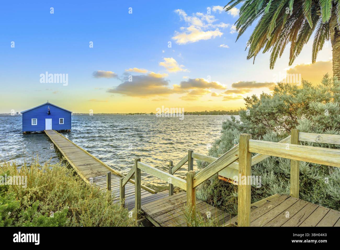 The iconic landscape of blue boat house from 1930s with wooden jetty on ...