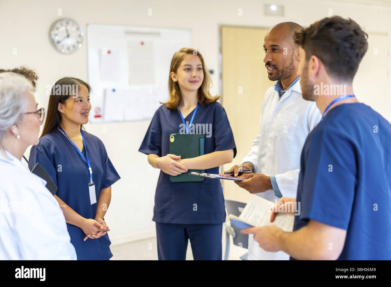 Diverse medical professionals collaborating, sharing expertise, and ...