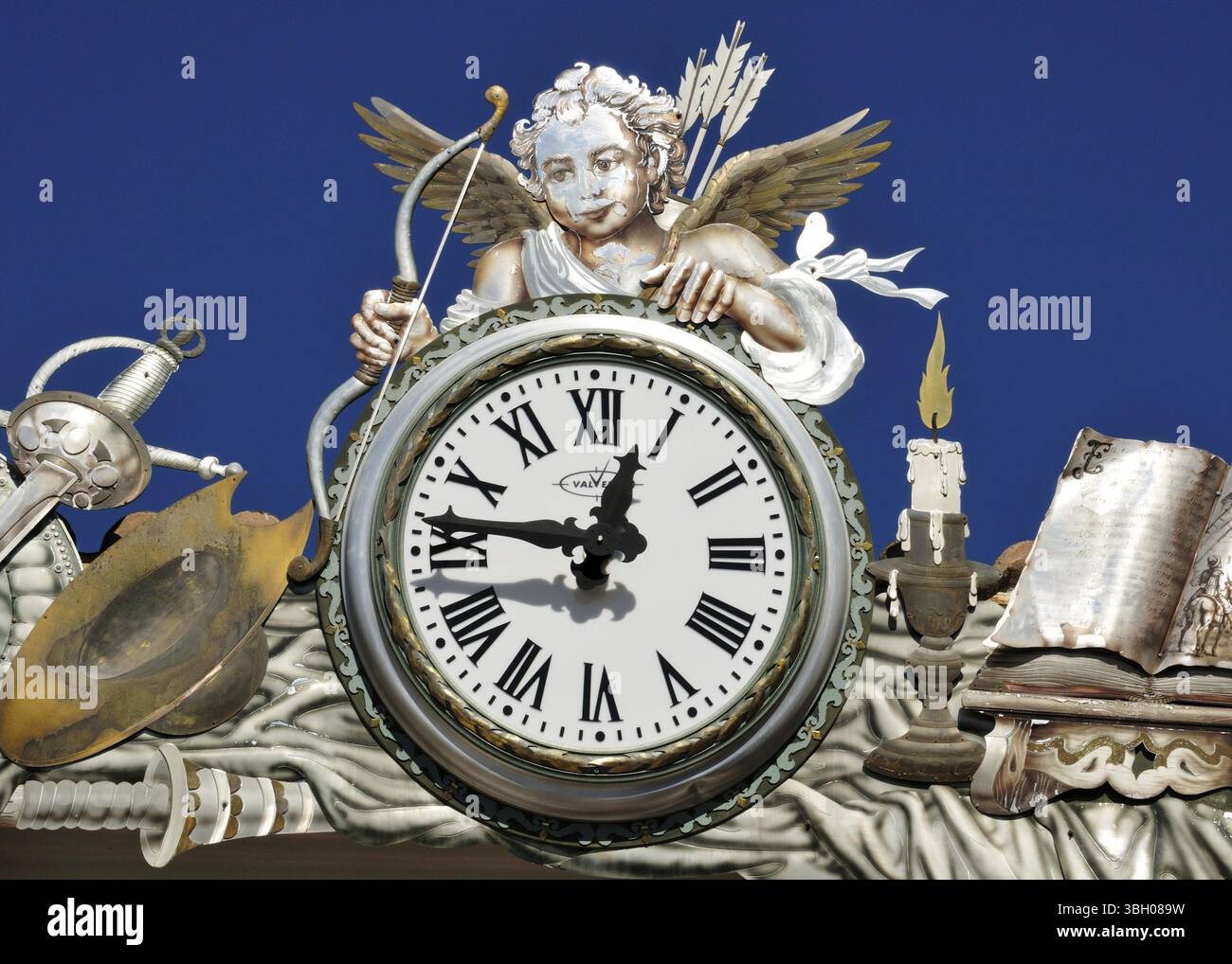 Classic style, the fantastic town hall clock with angel and blue sky ...