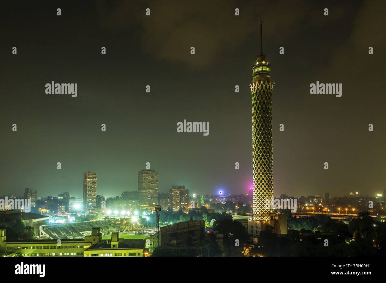 Cairo Tower colorfully lit at night in Downtown Cairo, Egypt, Cairo ...