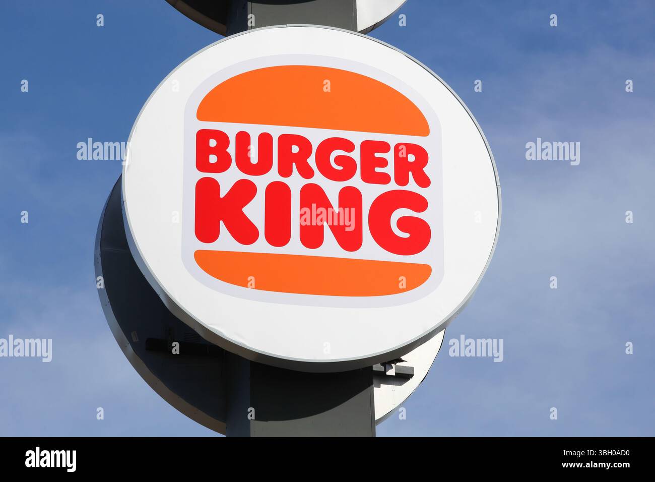 ogo of the fast food chain Burger King on a pole. Burger King is a ...