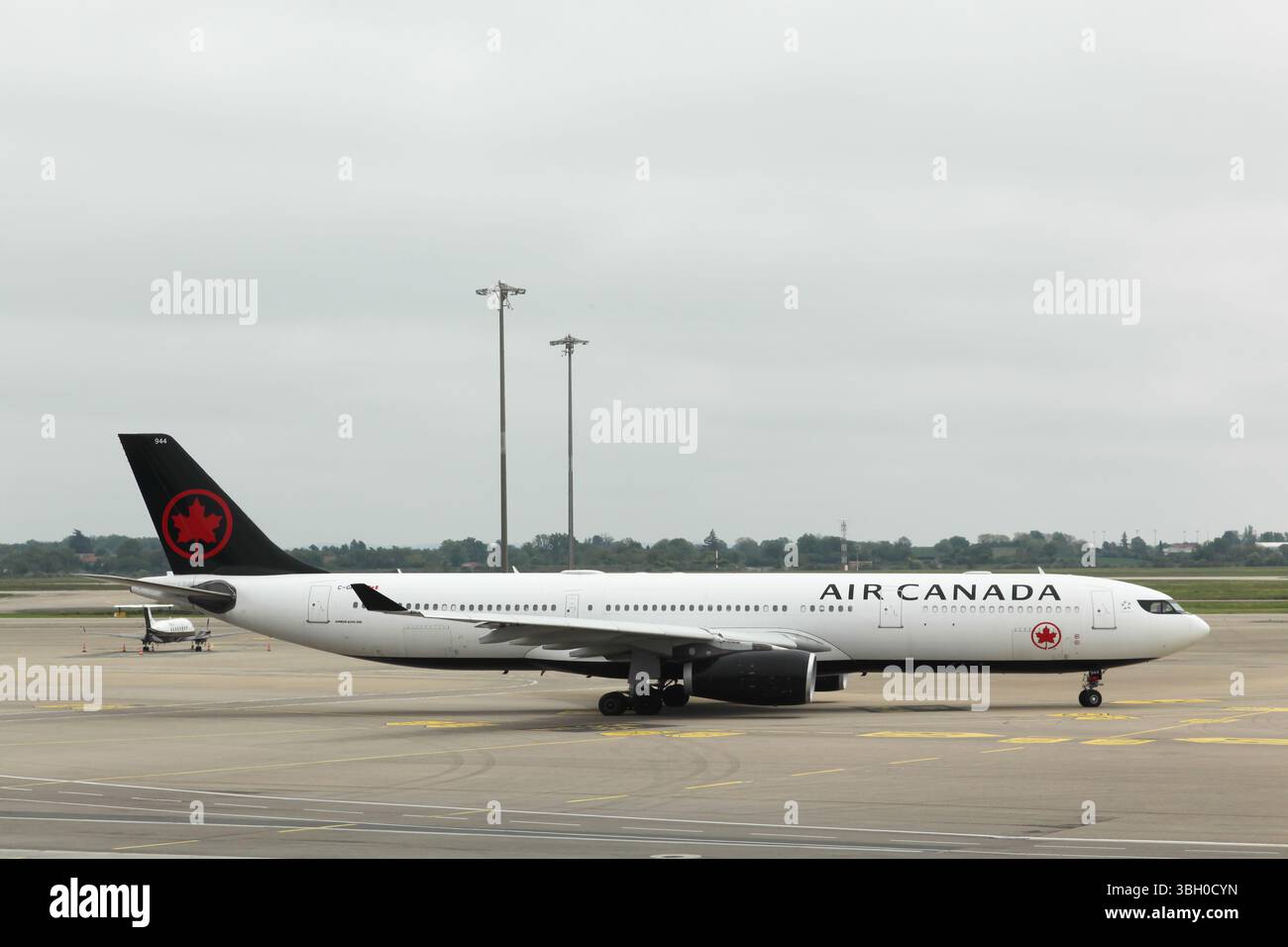 Air Canada aircraft at Lyon airport. Air Canada is the flag carrier and ...