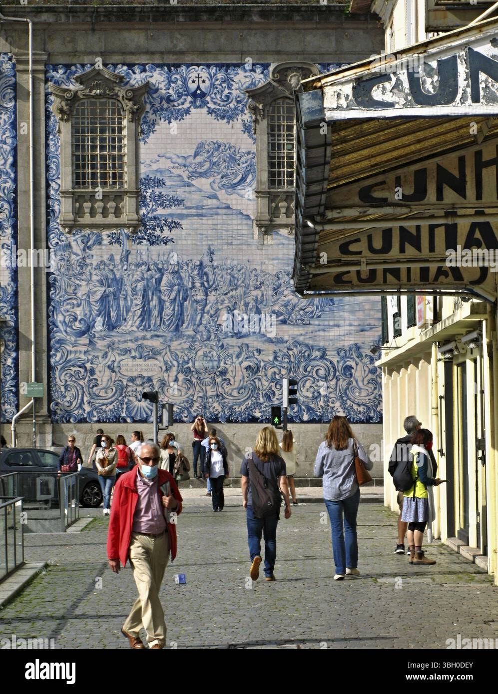 Lively streets and typical architecture with the famous tiled facades ...