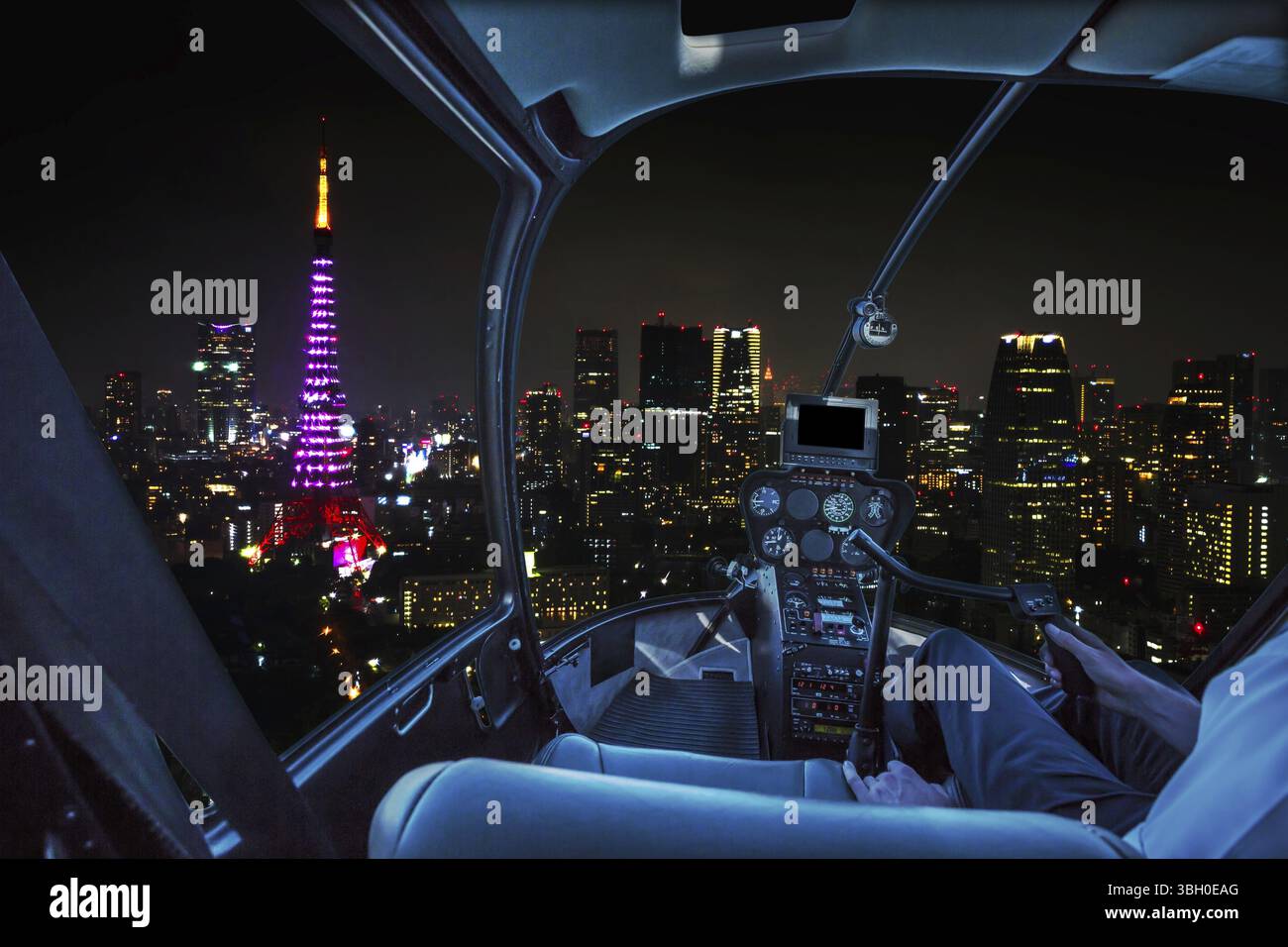 Helicopter flying over Tokyo tower and Tokyo cityscape view from ...