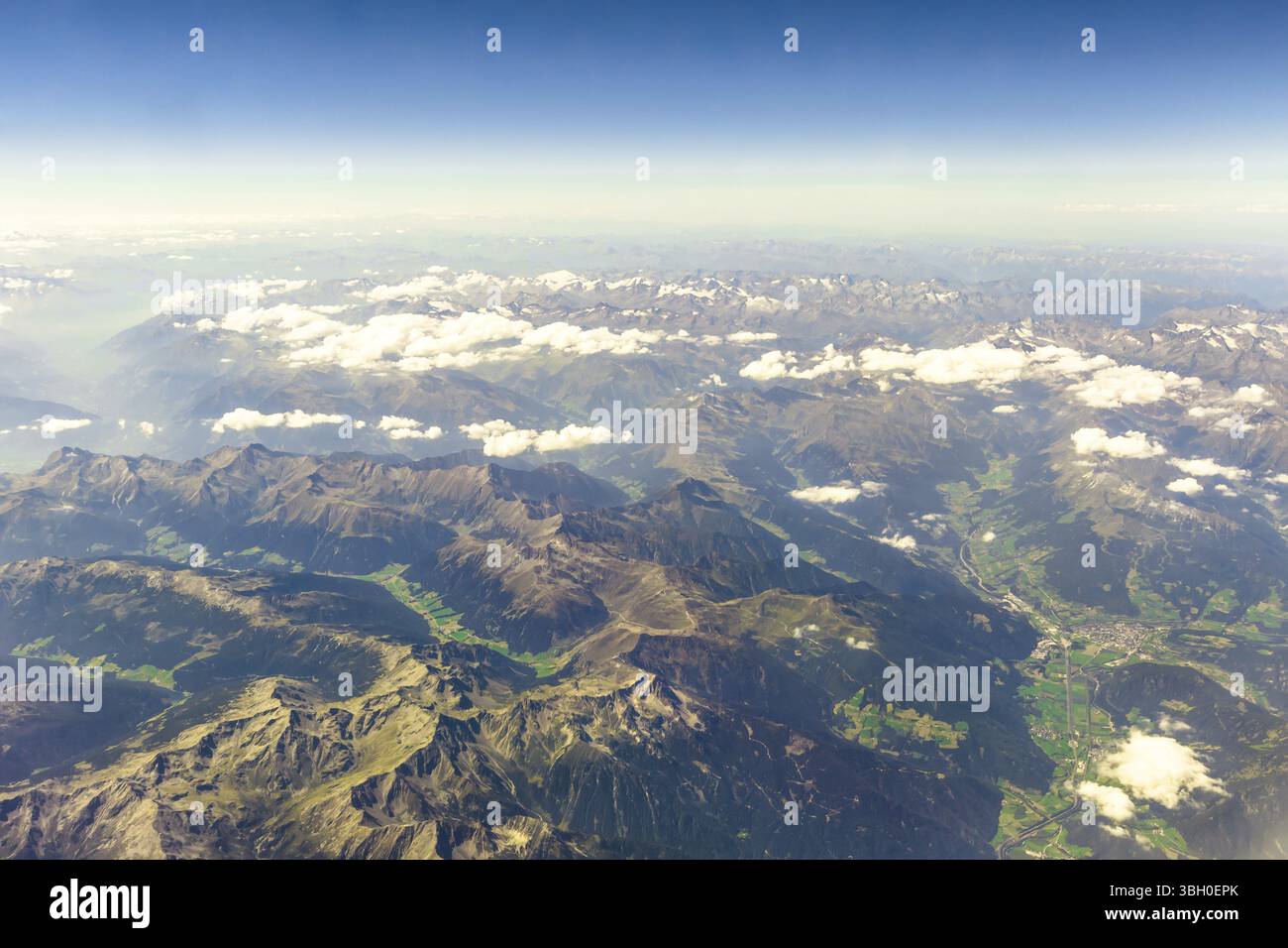 Scenic flight on Alps mountain range in Italy. Aerial view of Alpi ...