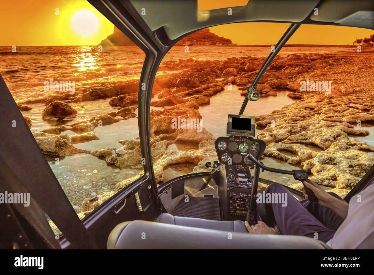Helicopter Cockpit on the reef at sunset, with pilot arm and control ...