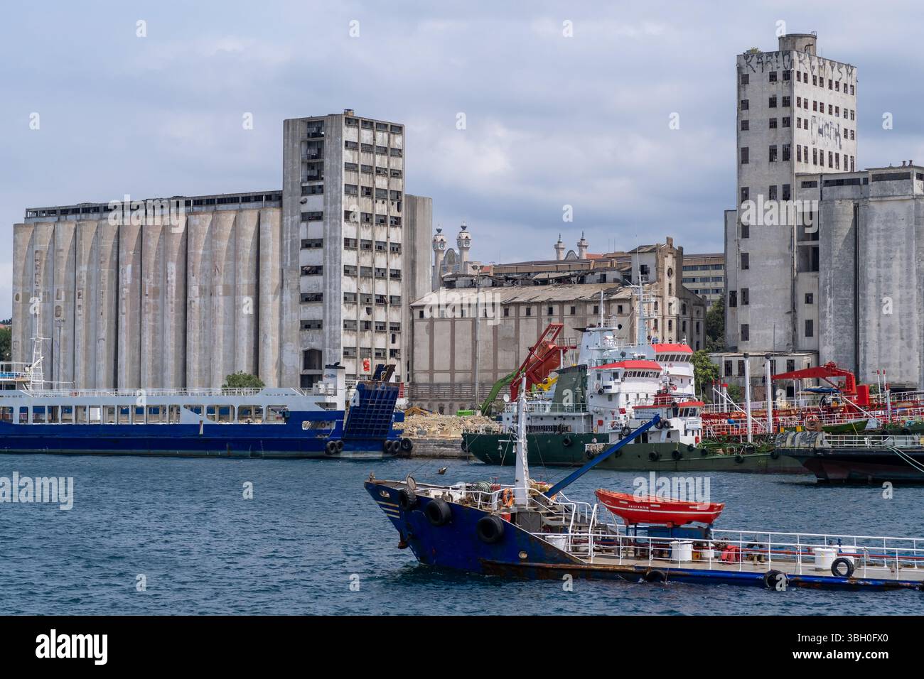 Bosphorus waterfront with industrial buildings and vessels docked ...