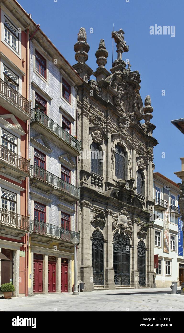 Historic church facade integrated into traditional buildings Stock ...