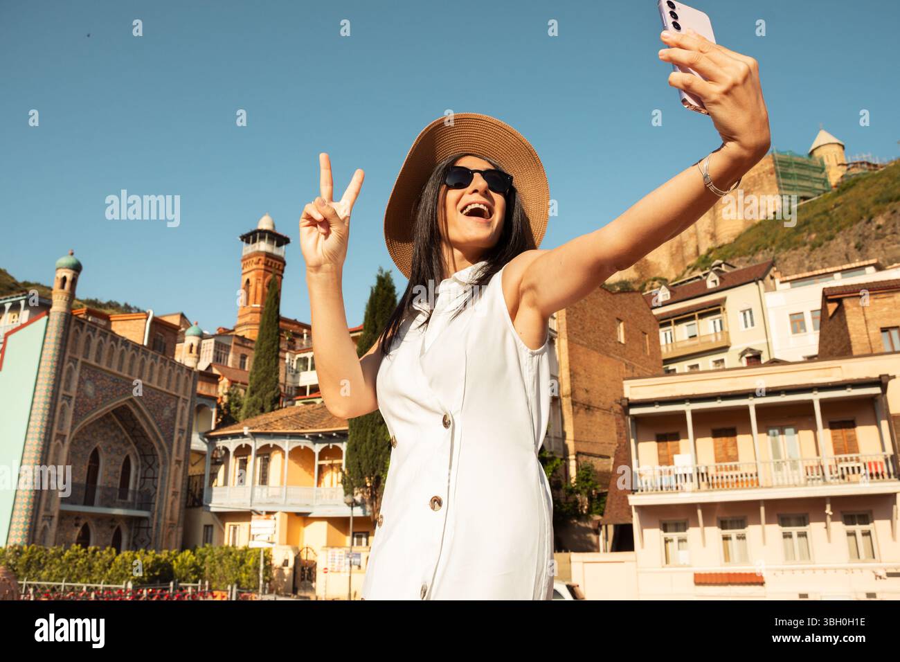 Happy tourist taking photos popular hi-res stock photography and images ...