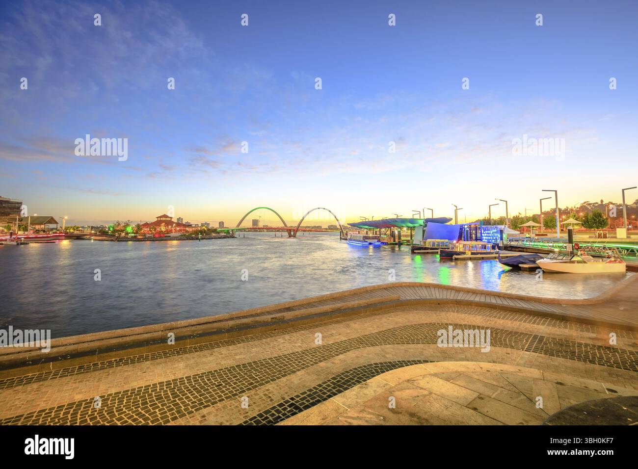 Elizabeth Quay Marina with docked boats and sunset light. Perth ...