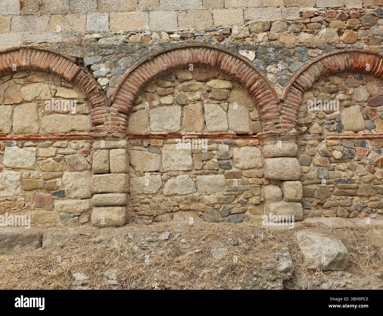 Arches of a bridge aqueduct from Roman times walled up with large ...