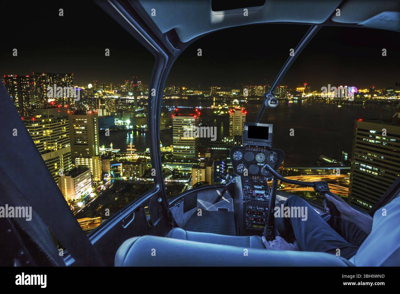 Helicopter flying over Tokyo cityscape, the Bay area with its bridges ...