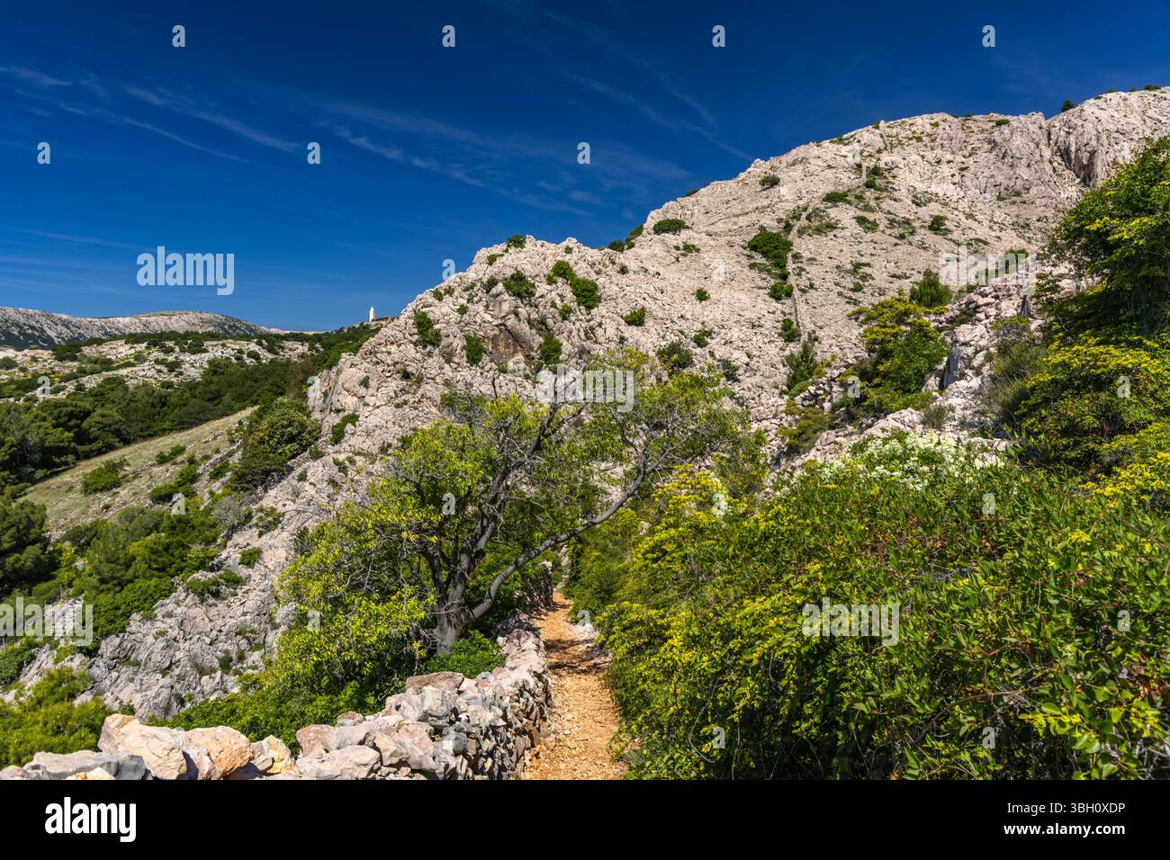 Hiking trail through the mountains from Baska to Vela Luka beach on the ...