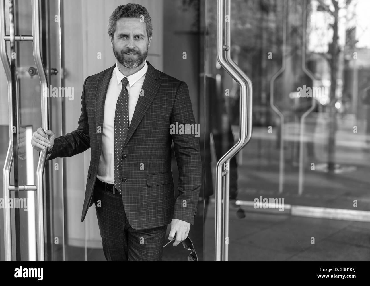 Successful businessman entering office. Mature entrepreneur at office ...