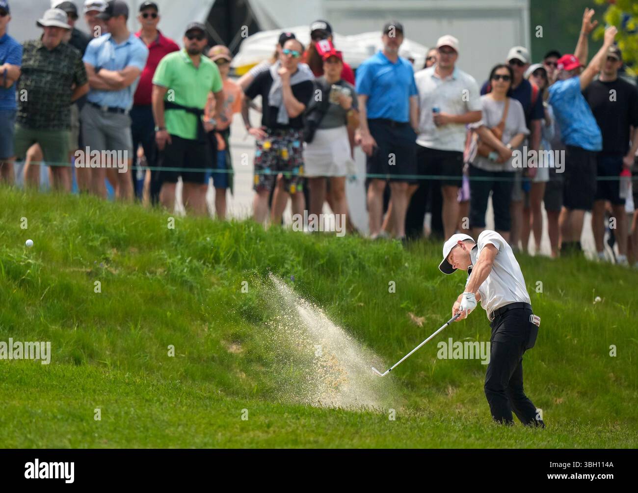 Luke Clanton blasts out of the fairway bunker on the fifth hole during ...