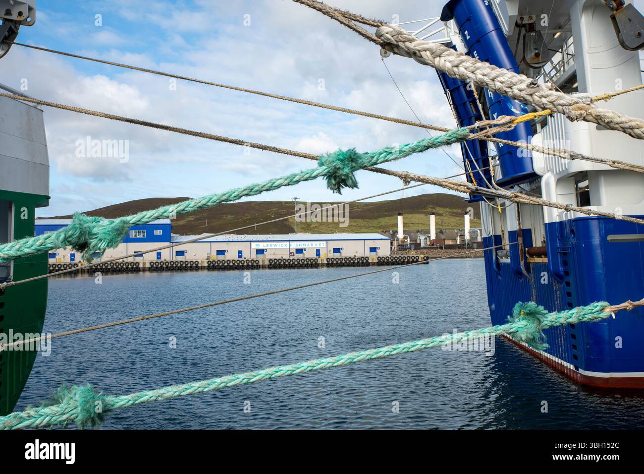 Fishing boats moored around Lerwick Fish Market at Mair's Quay ...