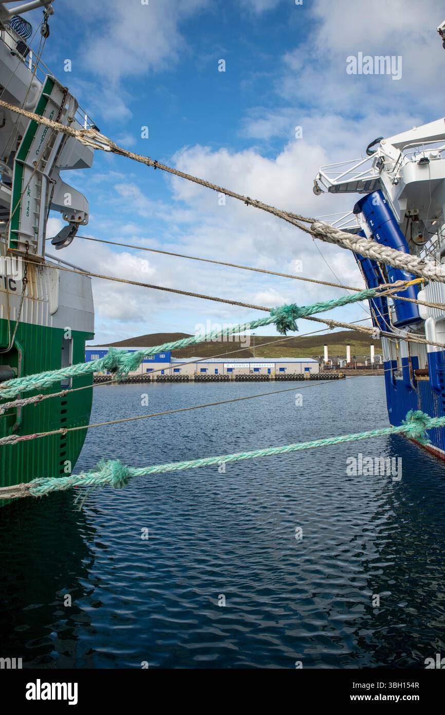 Fishing boats moored around Lerwick Fish Market at Mair's Quay ...