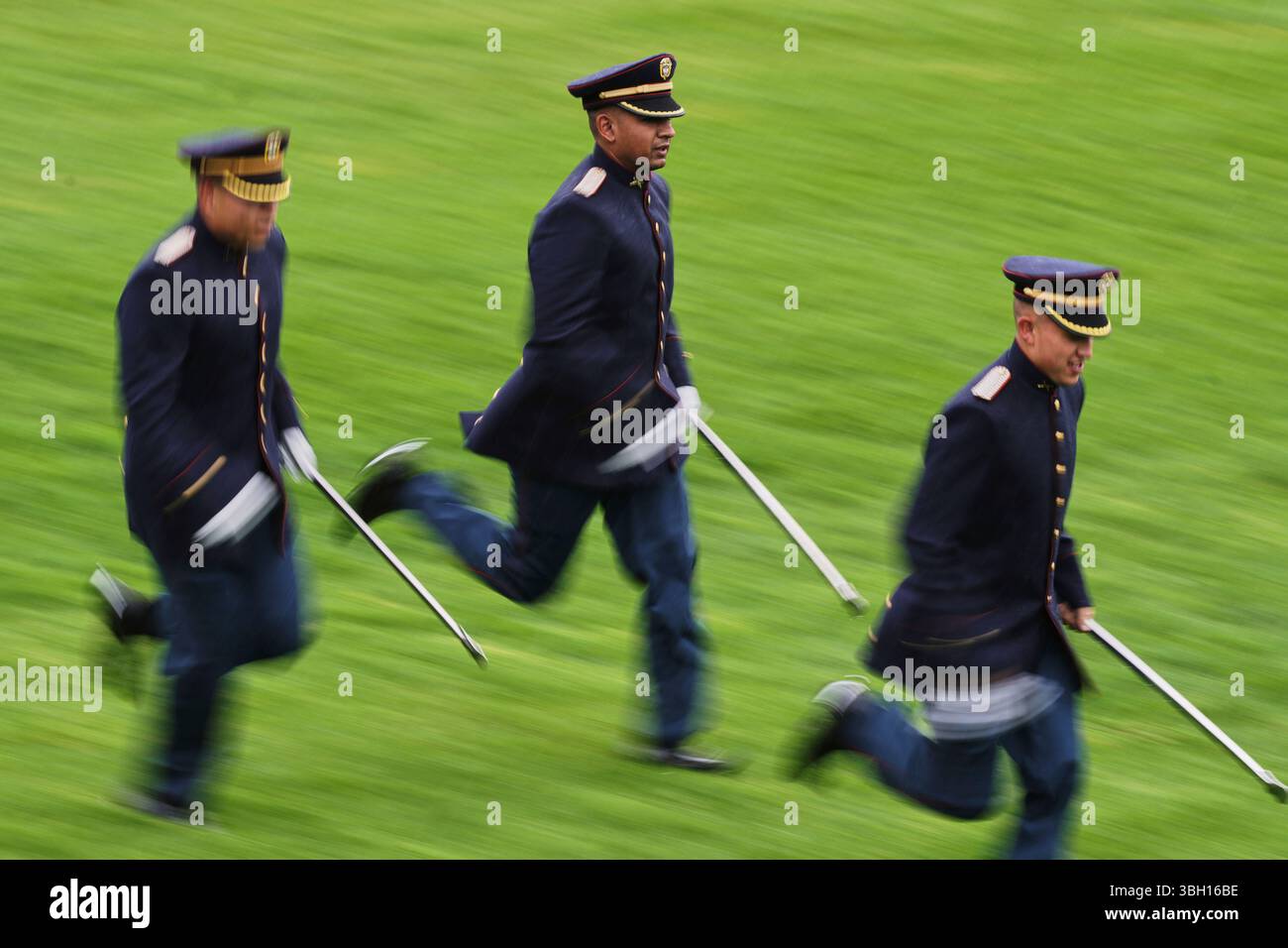 Army cadets run during a military ceremony in Bogota, Colombia, Friday ...