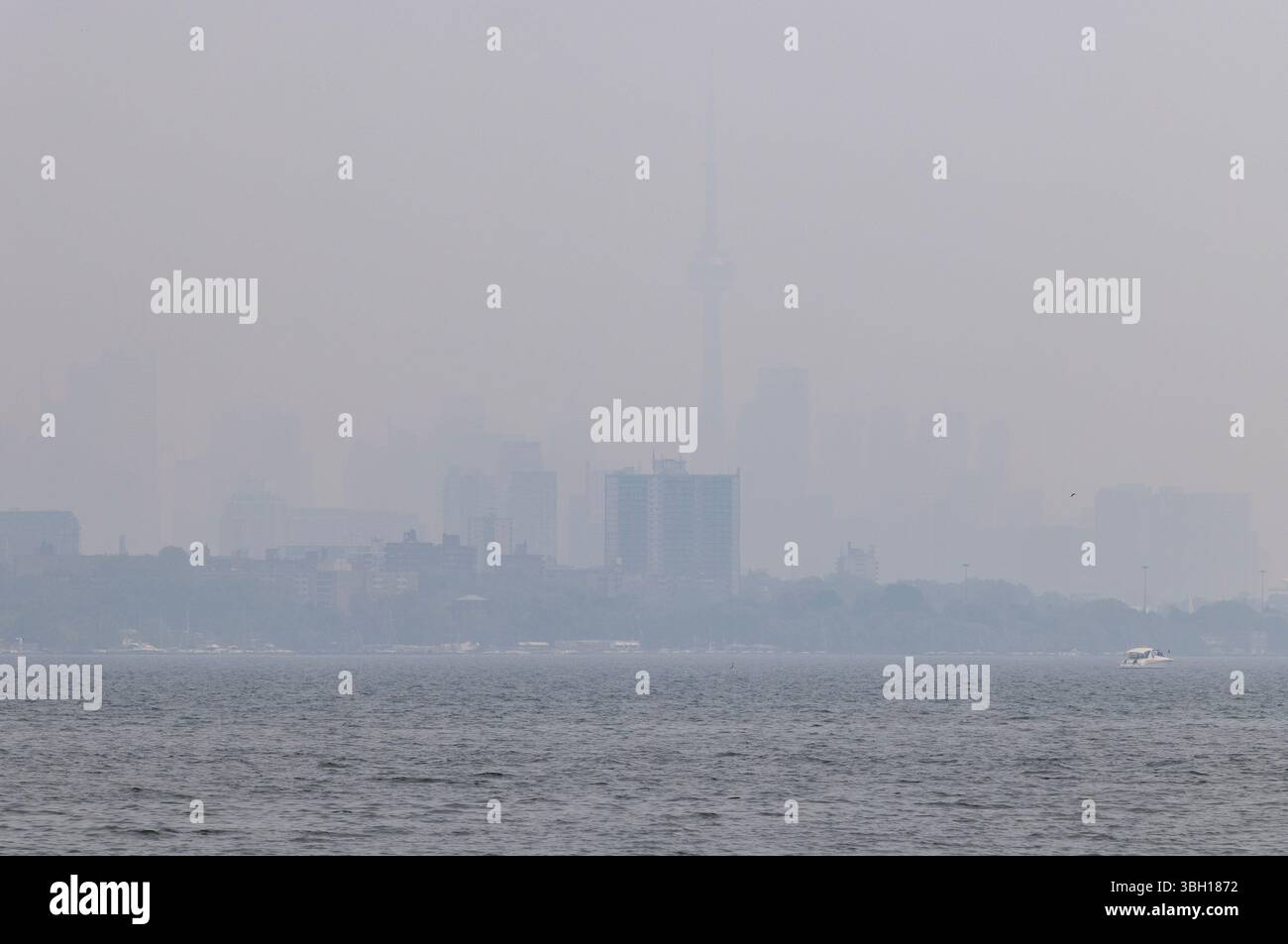 Toronto, Canada. 6th June, 2025. Buildings are shrouded in smoke from ...
