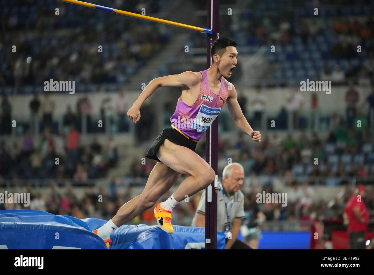 Woo Sanghyeok, of South Korea, celebrates after winning the men high ...