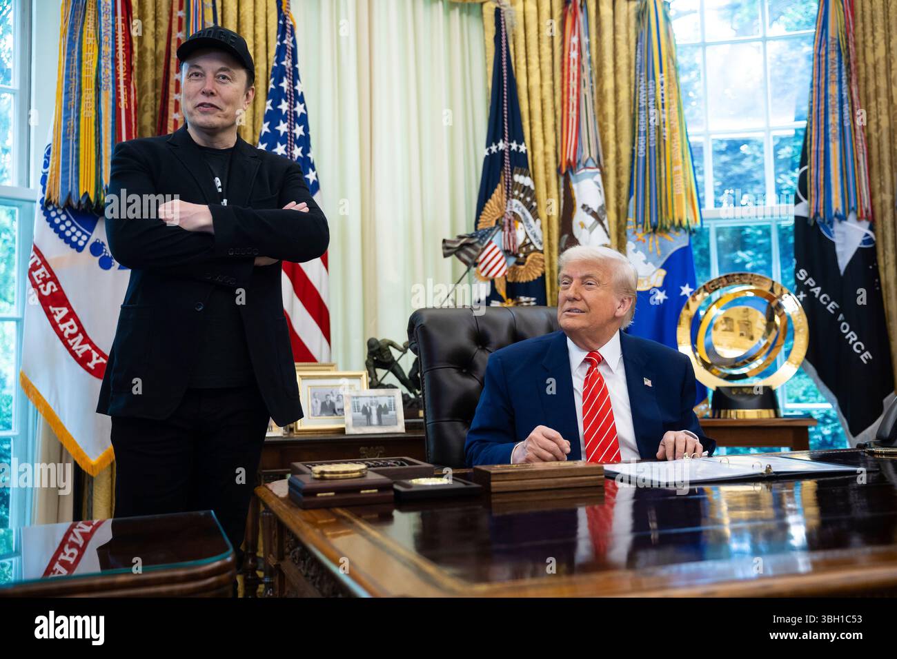 Elon Musk and President Donald Trump take part in a press conference in ...