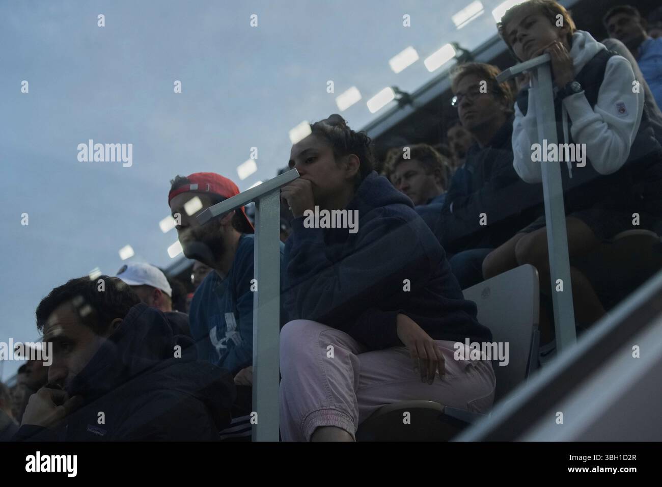 Spectators watch the semifinal match of the French Tennis Open between ...