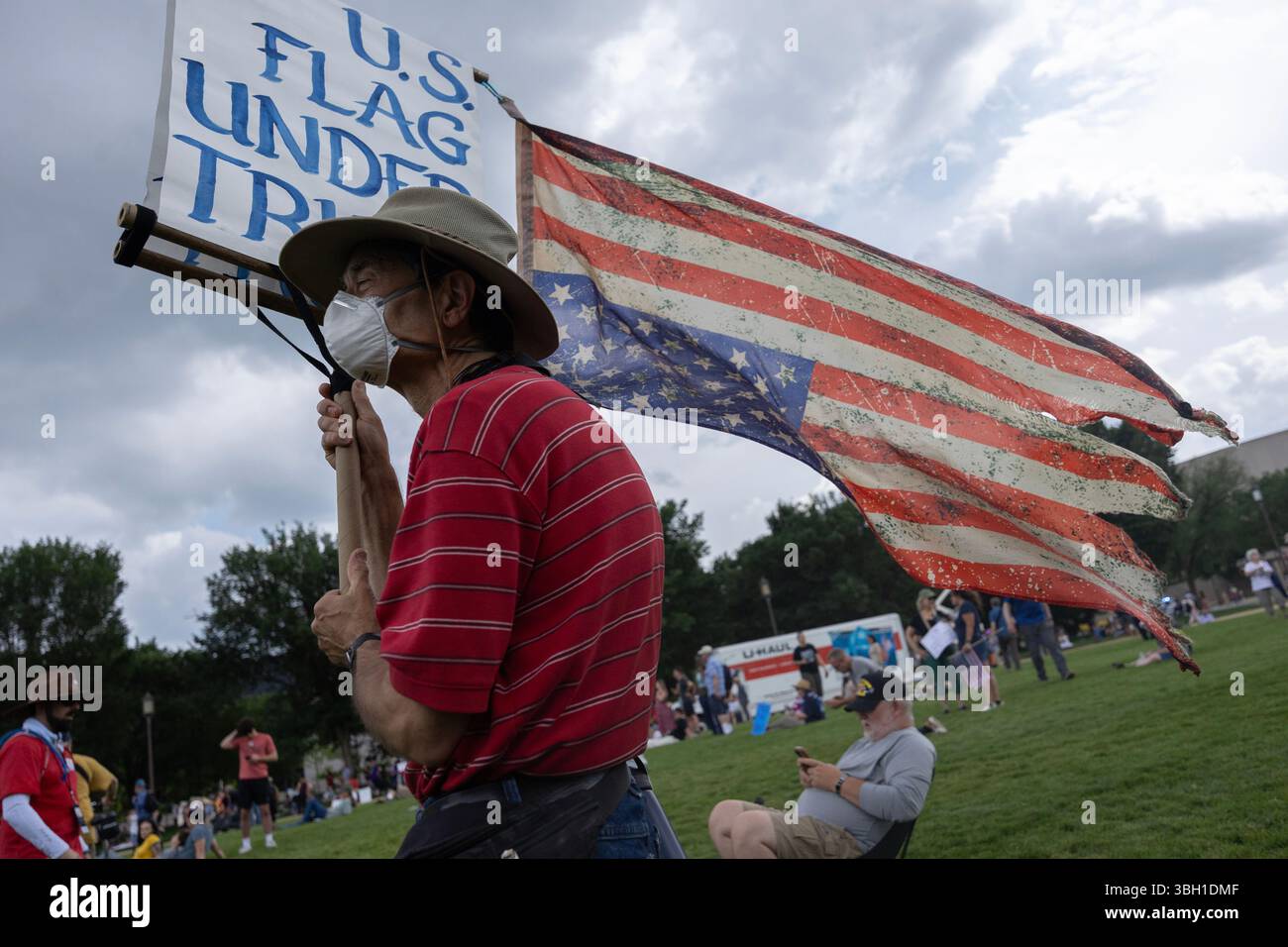 Paul Pallansch of Northern Virginia holds a tattered and worn flag ...