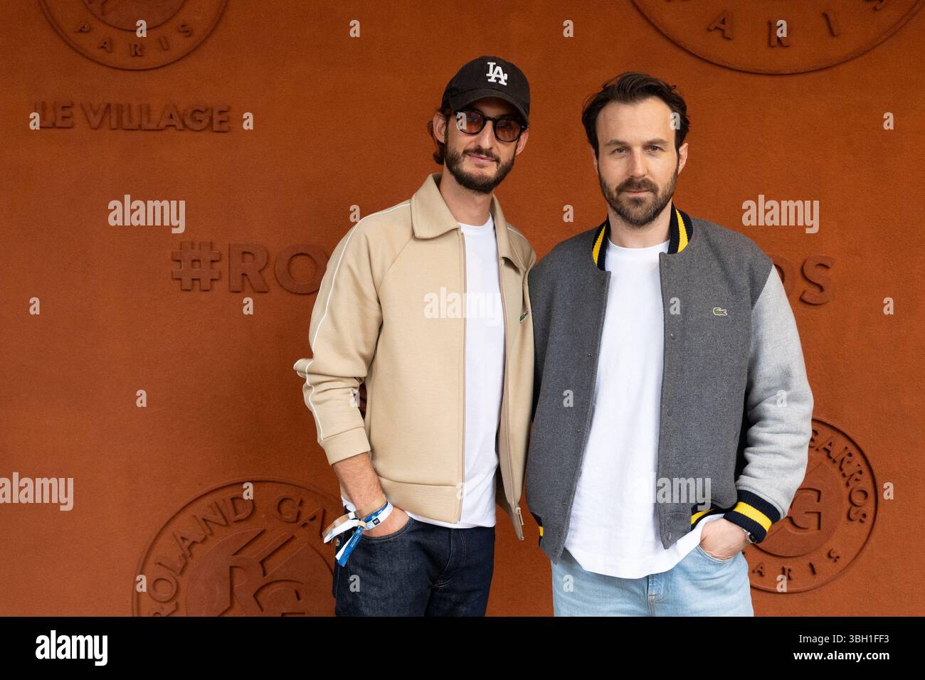 Pierre Niney and Antoine Gouy take a pose at Roland Garros for the ...