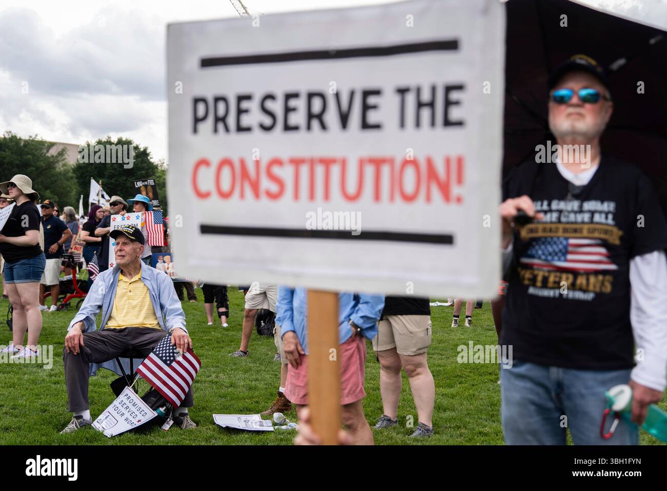 Veterans and others demonstrate at a Unite for Veterans rally, Friday ...