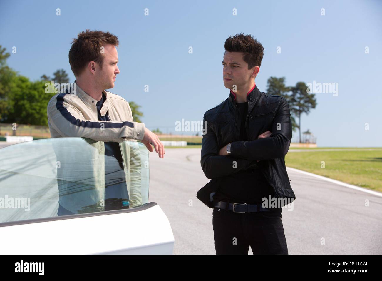 Tobey Marshall (Aaron Paul, left) confronts Dino Brewster (Dominic Cooper) in this scene from ...