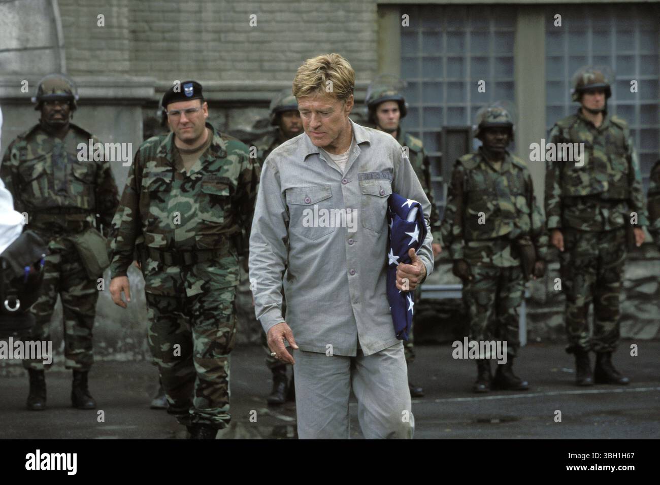 Prisoner Irwin (ROBERT REDFORD, center) takes the flag and turns his ...