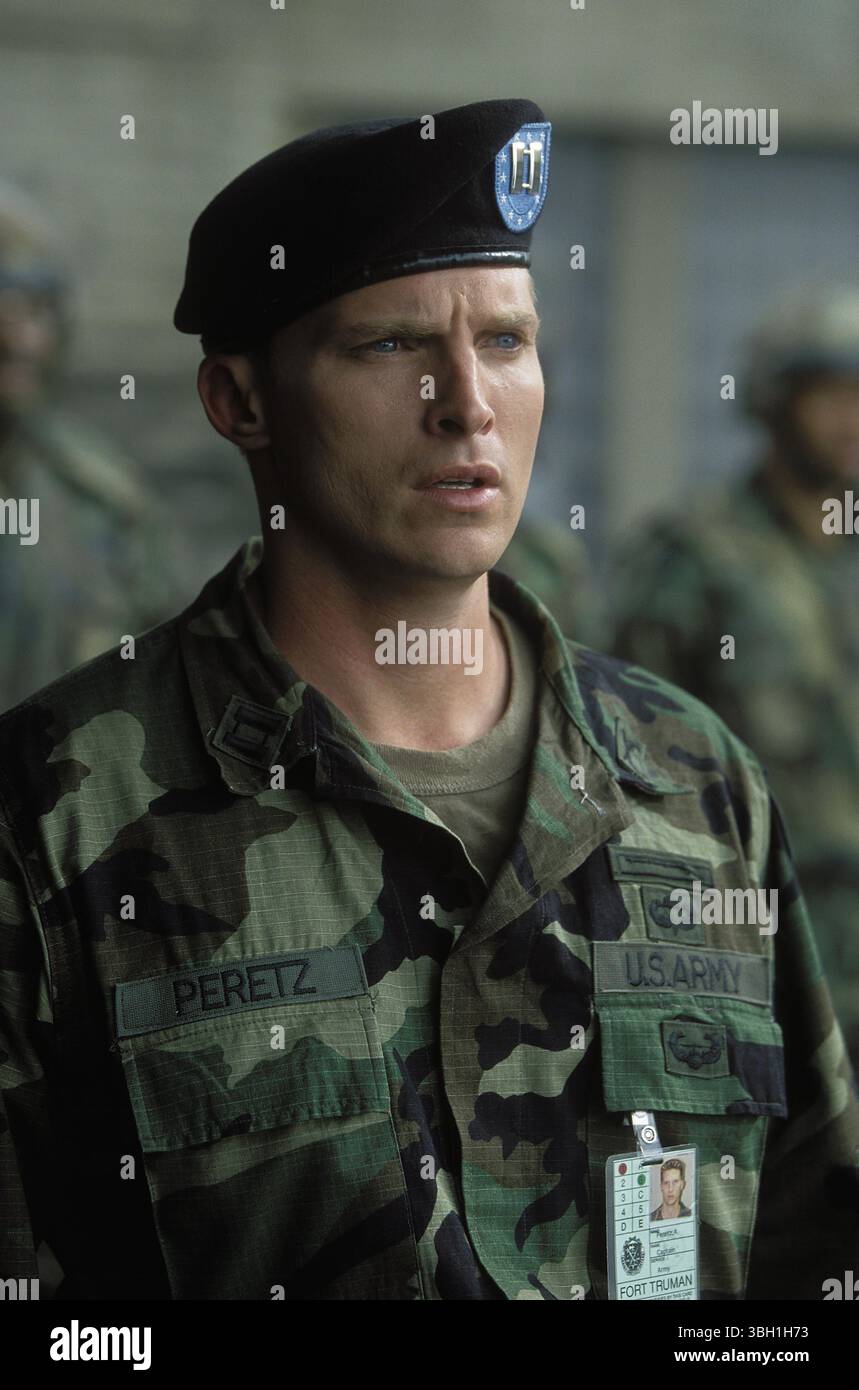 Captain Peretz (STEVE BURTON) watches as Colonel Winter confronts Irwin ...
