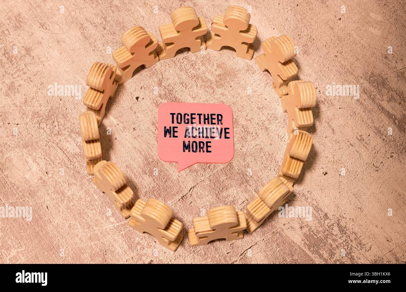 Together everyone achieves more message written on ripped torn ...