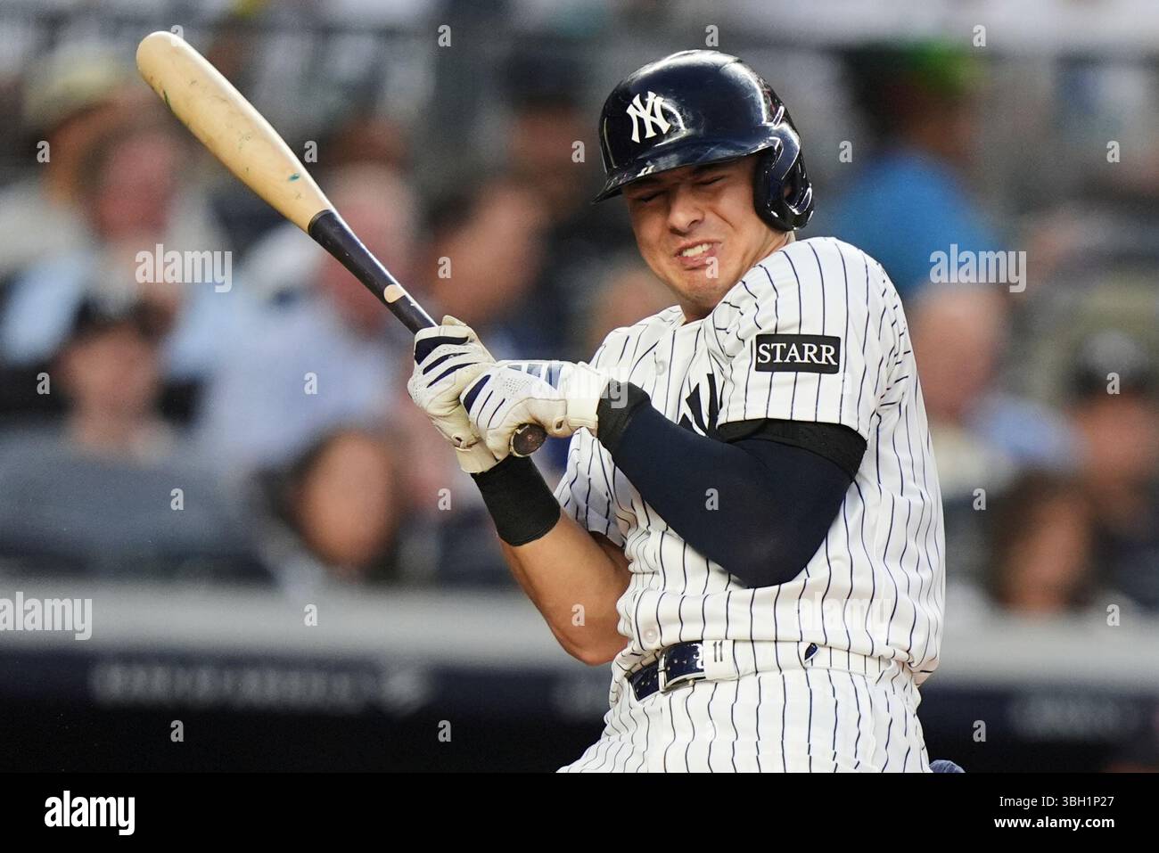 New York Yankees' Anthony Volpe reacts as he is hit by a pitch during ...