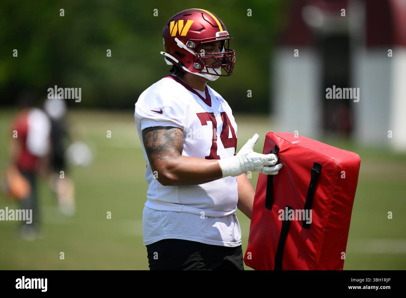 Washington Commanders offensive tackle Brandon Coleman (74) works out ...