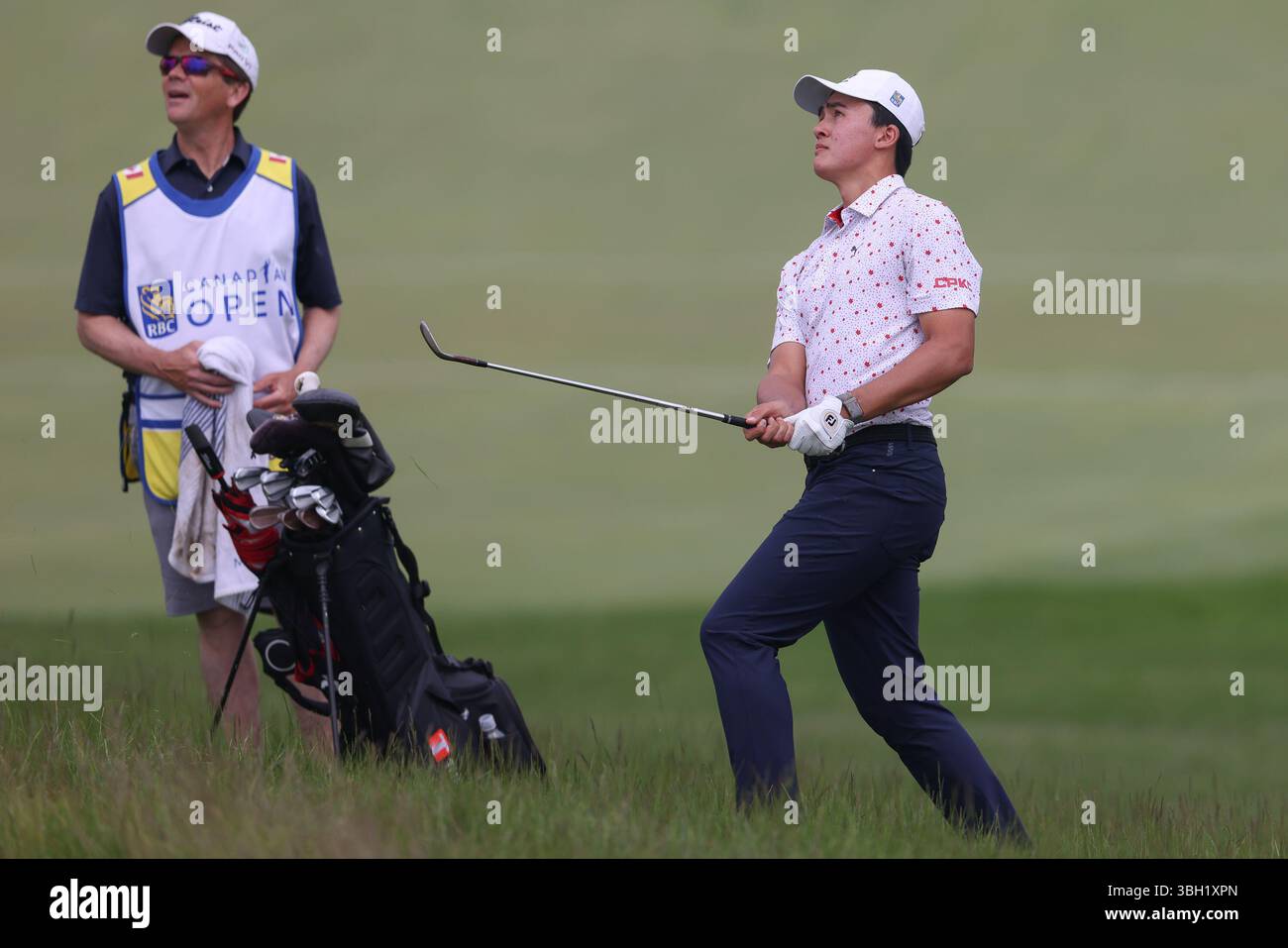 June 06, 2025: Matthew Javier and his caddy watch the flight of the ...