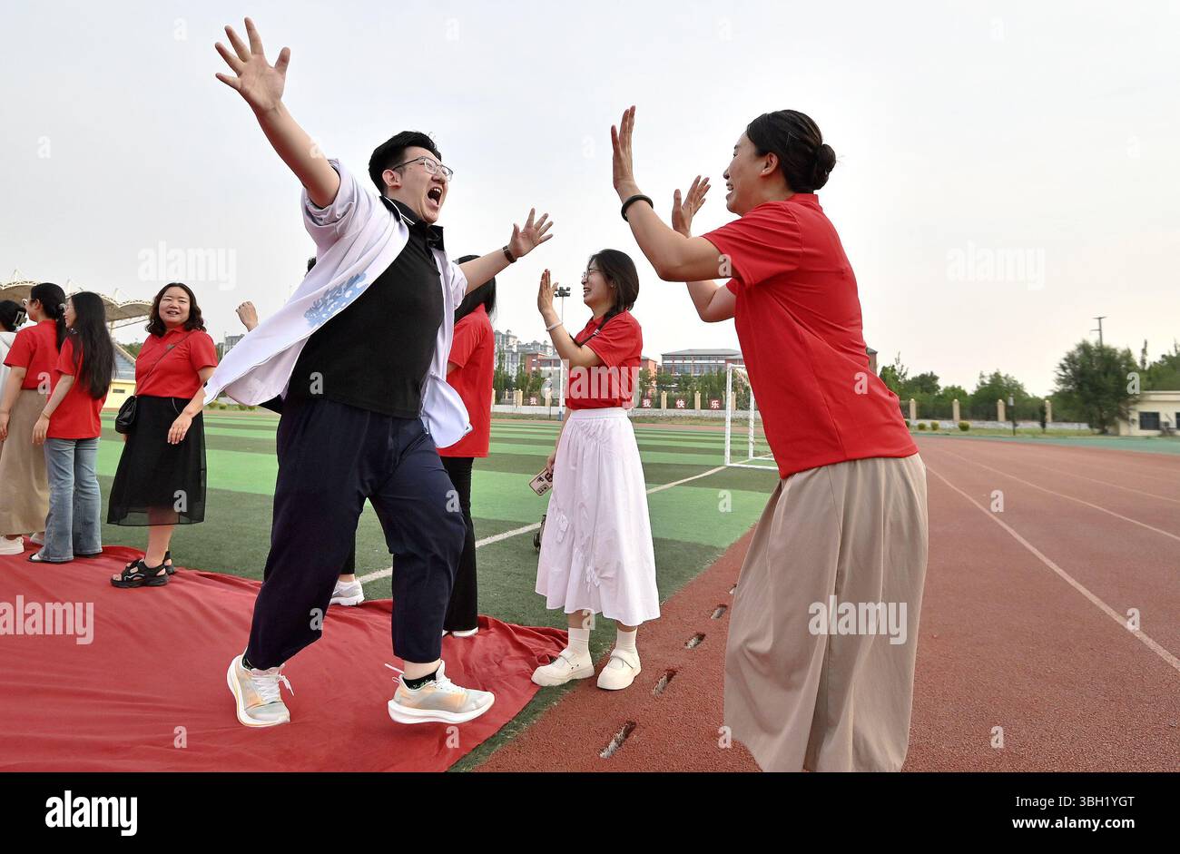 HANDAN, CHINA - JUNE 7, 2025 - Teachers and students taking the college ...