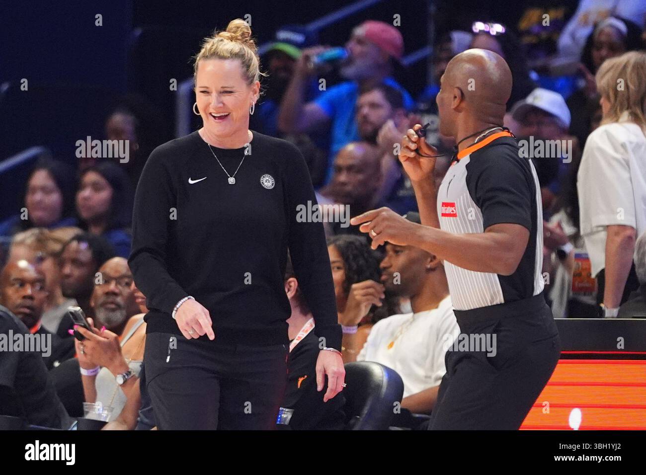 Los Angeles Sparks head coach Lynne Roberts, left, smiles during the ...