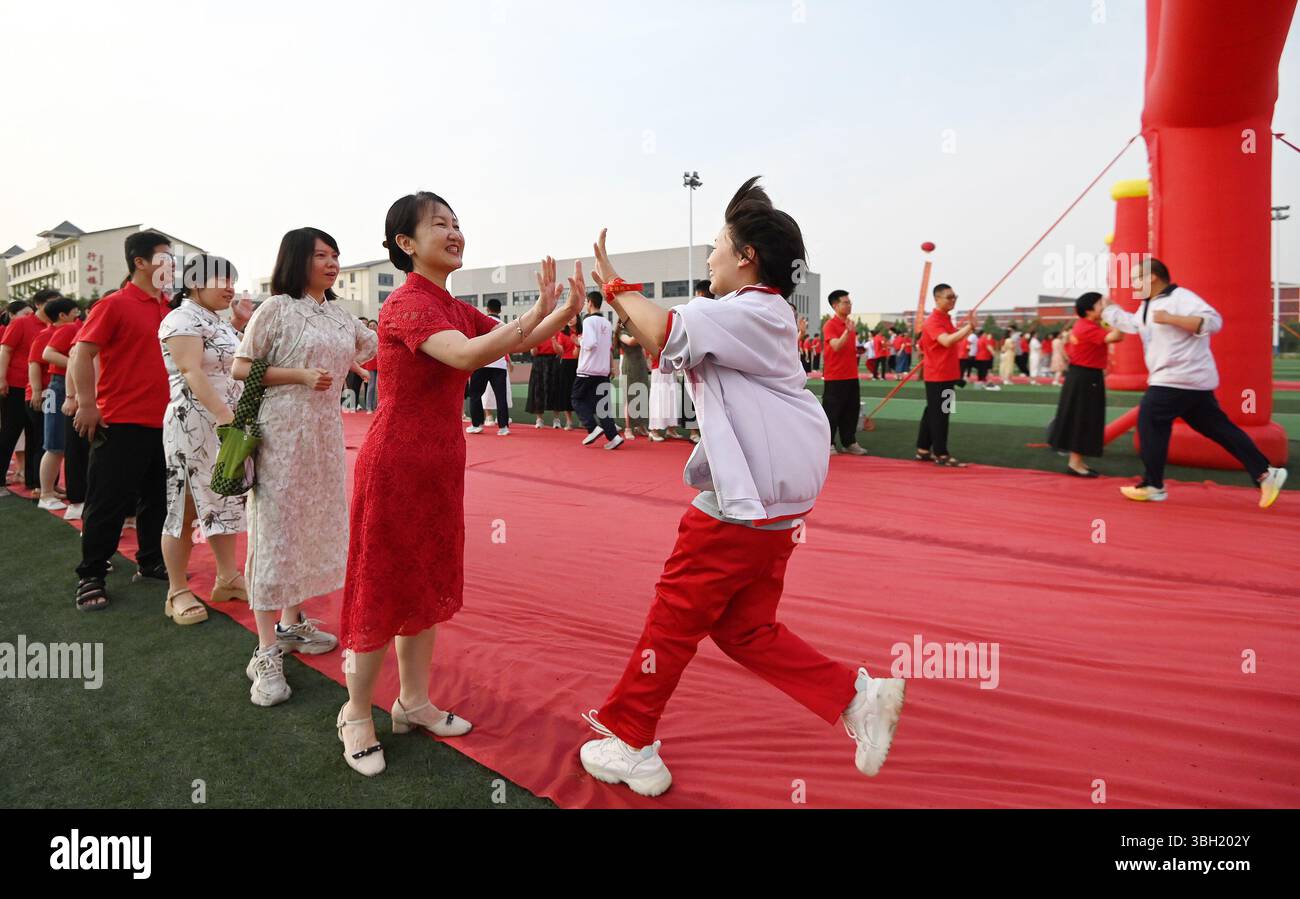 HANDAN, CHINA - JUNE 7, 2025 - Teachers and students taking the college ...
