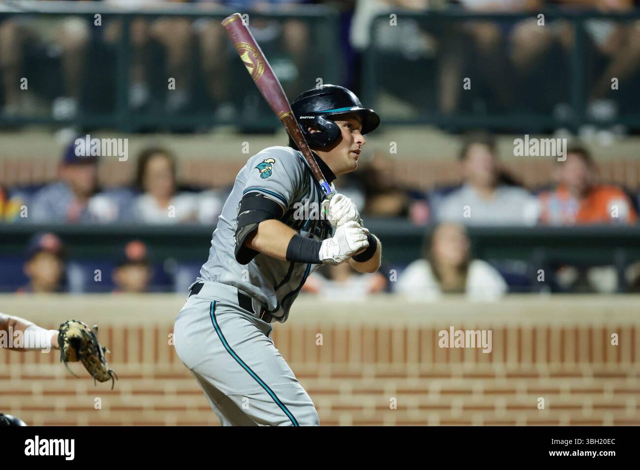 Coastal Carolina's Caden Bodine (17) hits a solo home run during an ...