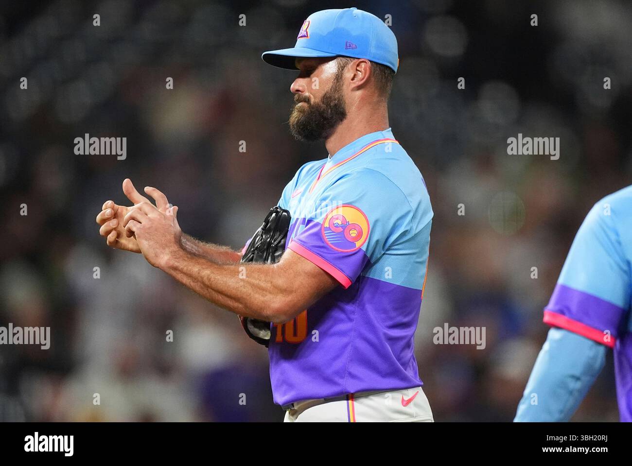 Colorado Rockies relief pitcher Tyler Kinley reacts after giving up a ...