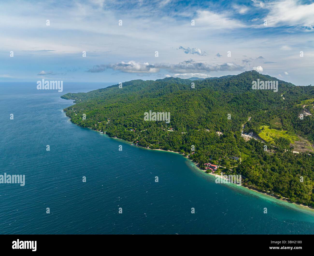 Tropical island and deep blue sea and waves. Samal Island. Davao ...