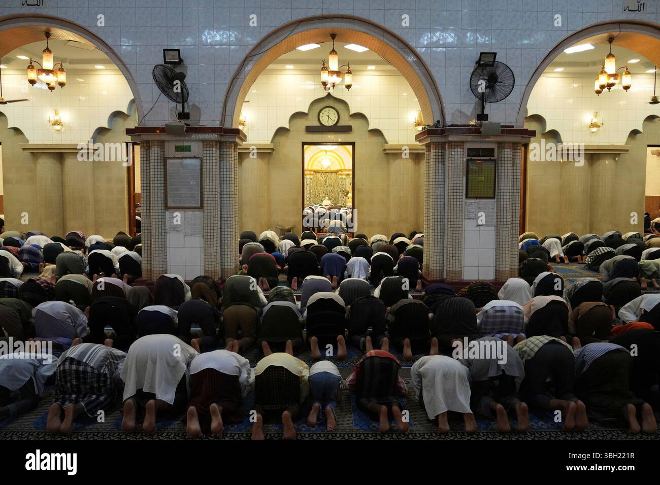 Myanmar Muslims offer a prayer to mark celebrations of Eid al-Adha at a ...