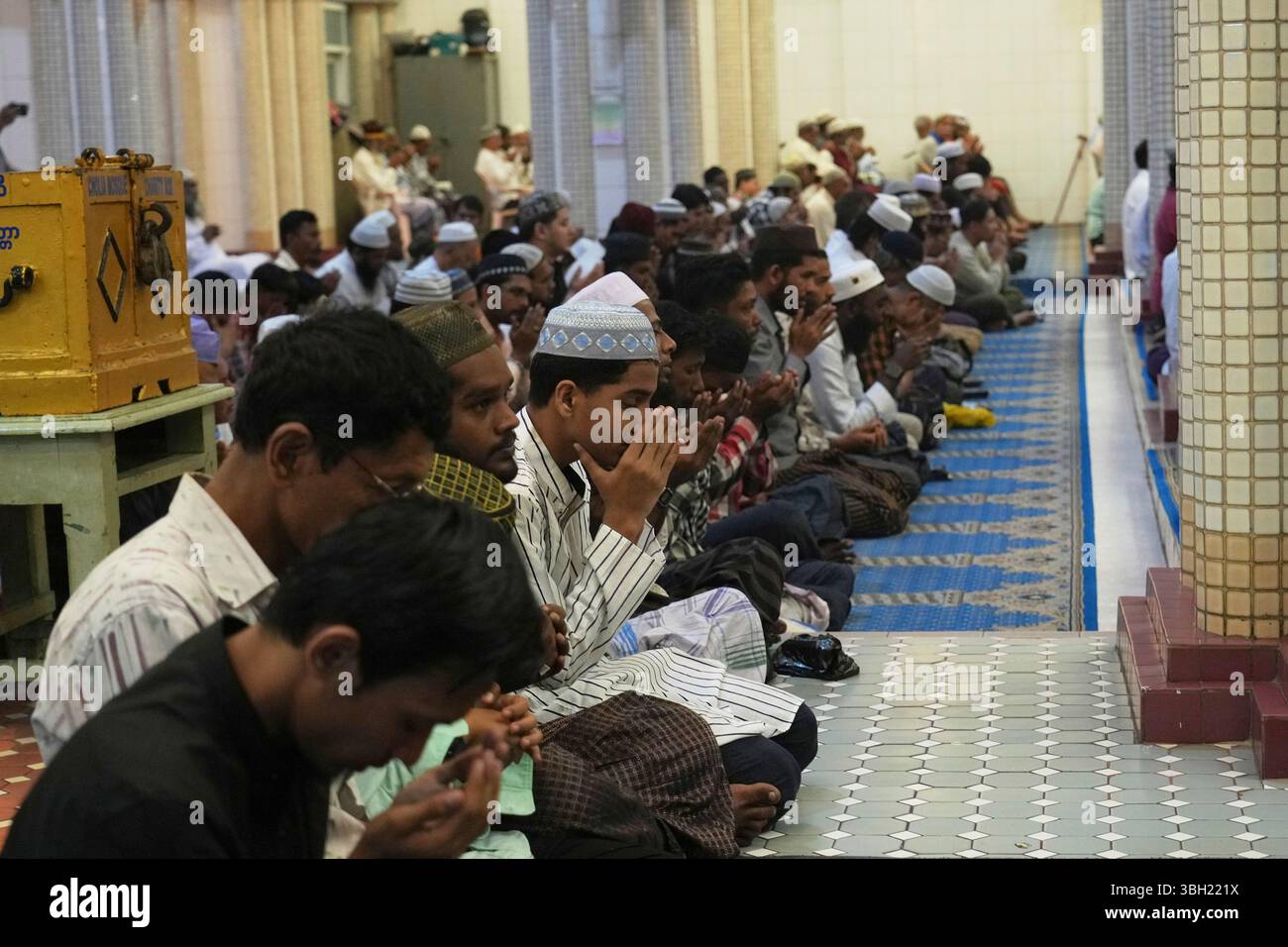 Myanmar Muslims offer a prayer to mark celebrations of Eid al-Adha at a ...