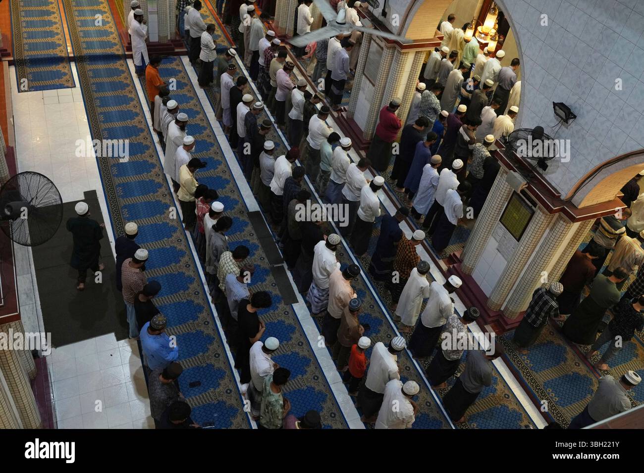 Myanmar Muslims offer a prayer to mark celebrations of Eid al-Adha at a ...