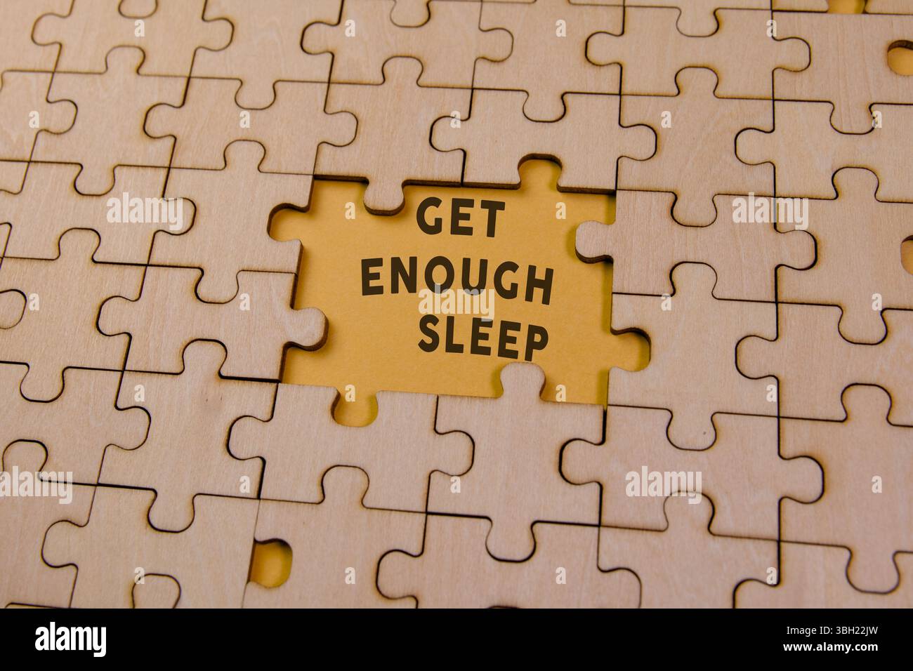 Wooden puzzle pieces with a message about the importance of sleep for ...