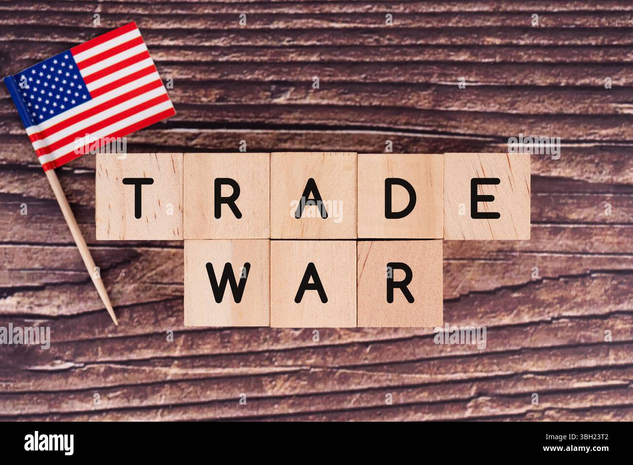 Trade war concept with block letters reading "TRADE WAR" and US flag on ...