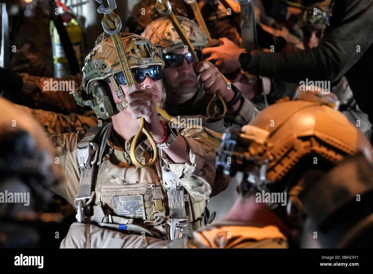 Chilean Paracaidistas prepare for a static line jump from an MC-130 ...