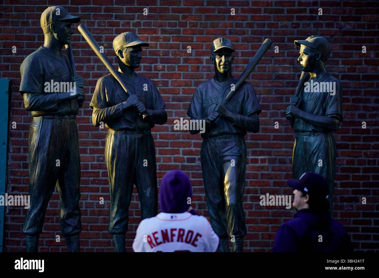 FILE-Fans take a picture with statues of Red Sox legends outside Fenway ...
