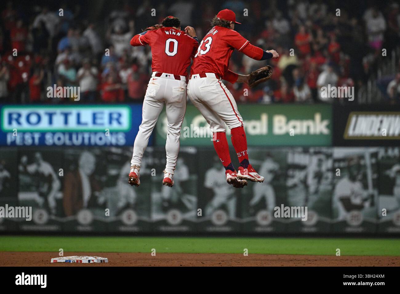 St. Louis Cardinals' shortstop Masyn Winn (0), left, and teammate ...